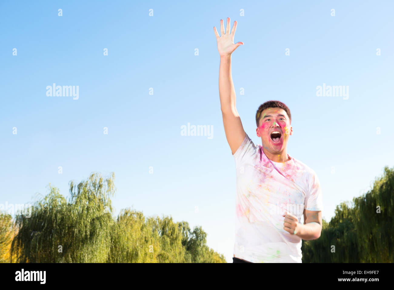 Young man at The Color Run Stock Photo - Alamy