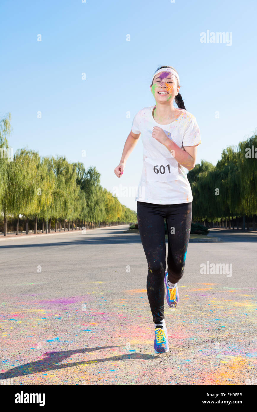 Young woman at The Color Run Stock Photo - Alamy