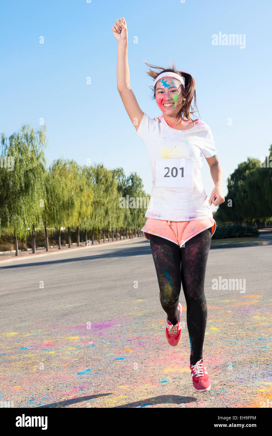 Young woman at The Color Run Stock Photo - Alamy