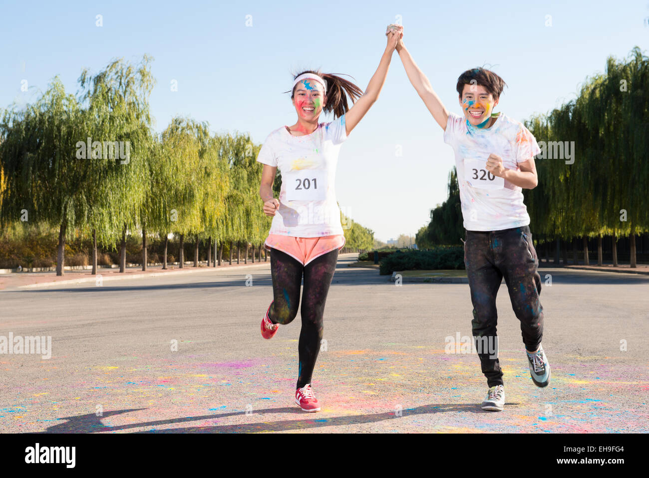 Young couple at The Color Run Stock Photo - Alamy