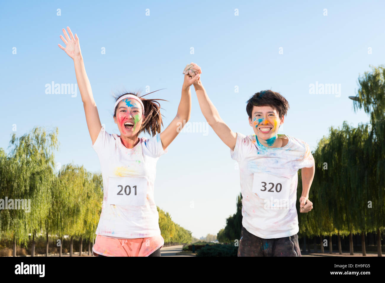 Young couple at The Color Run Stock Photo - Alamy