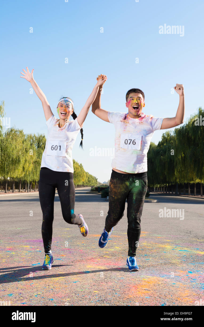 Young couple at The Color Run Stock Photo - Alamy