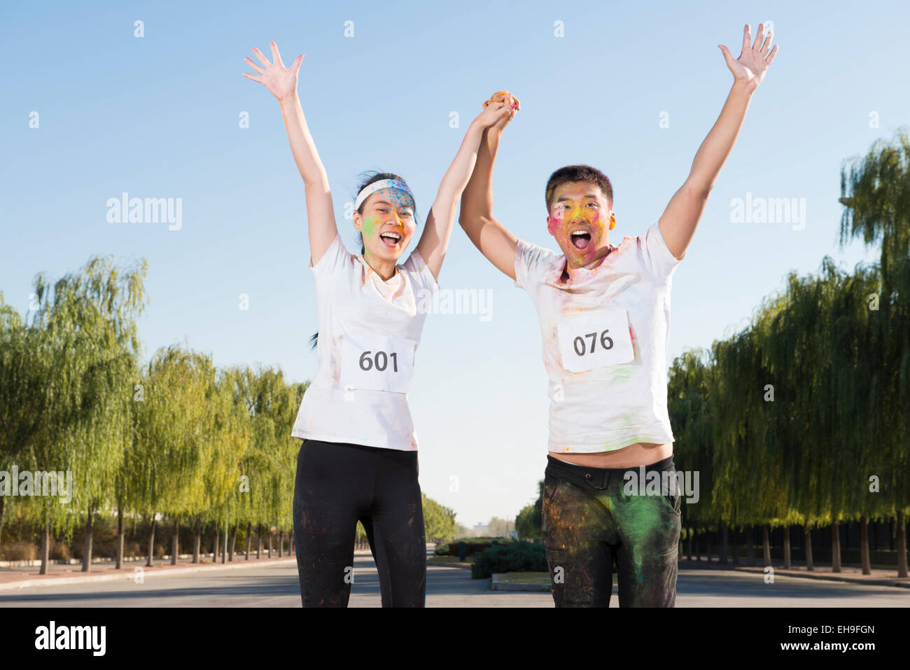 Young couple at The Color Run Stock Photo - Alamy