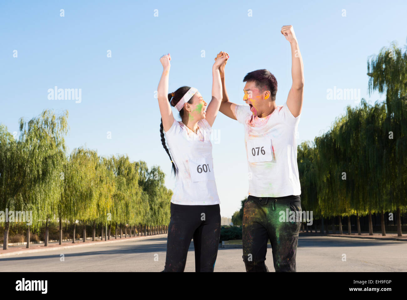 Young couple at The Color Run Stock Photo - Alamy