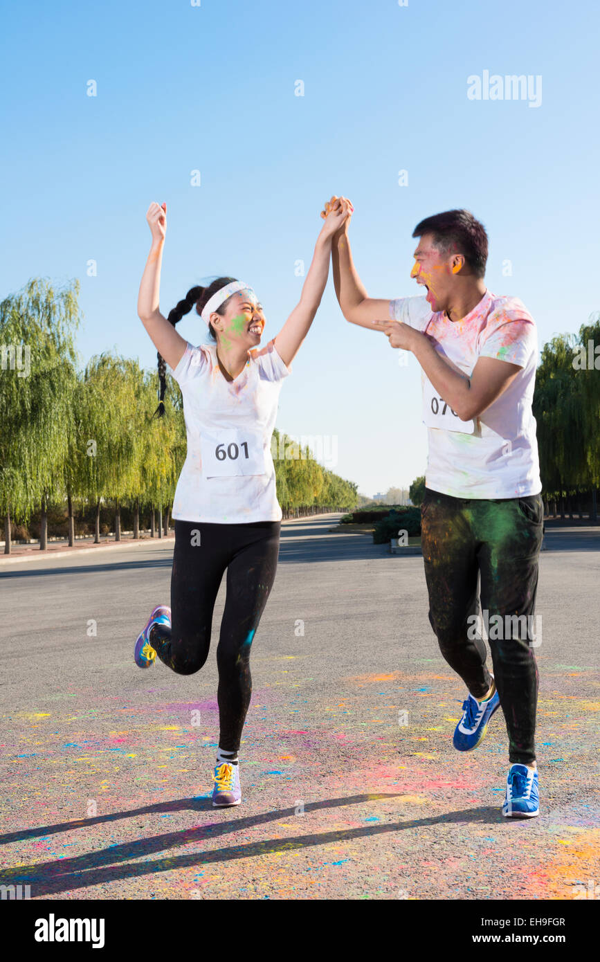 Young couple at The Color Run Stock Photo - Alamy