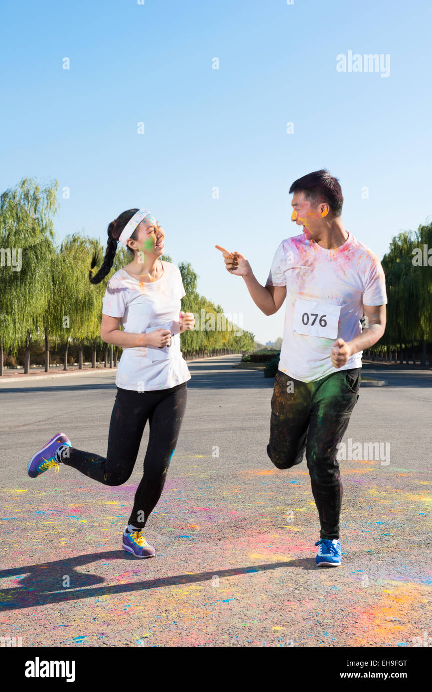 Young couple at The Color Run Stock Photo - Alamy