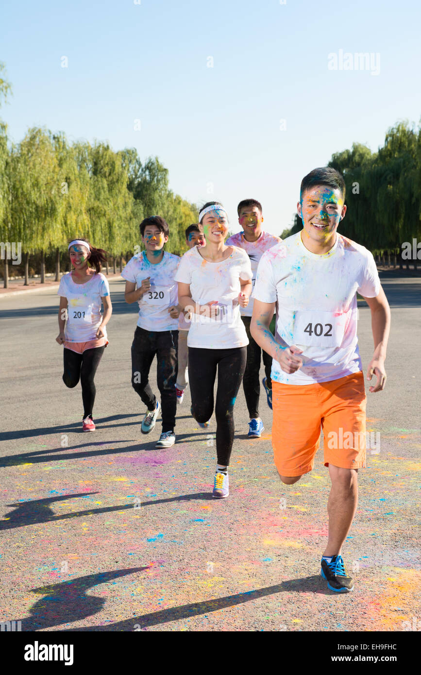 Young man leading at The Color Run Stock Photo - Alamy