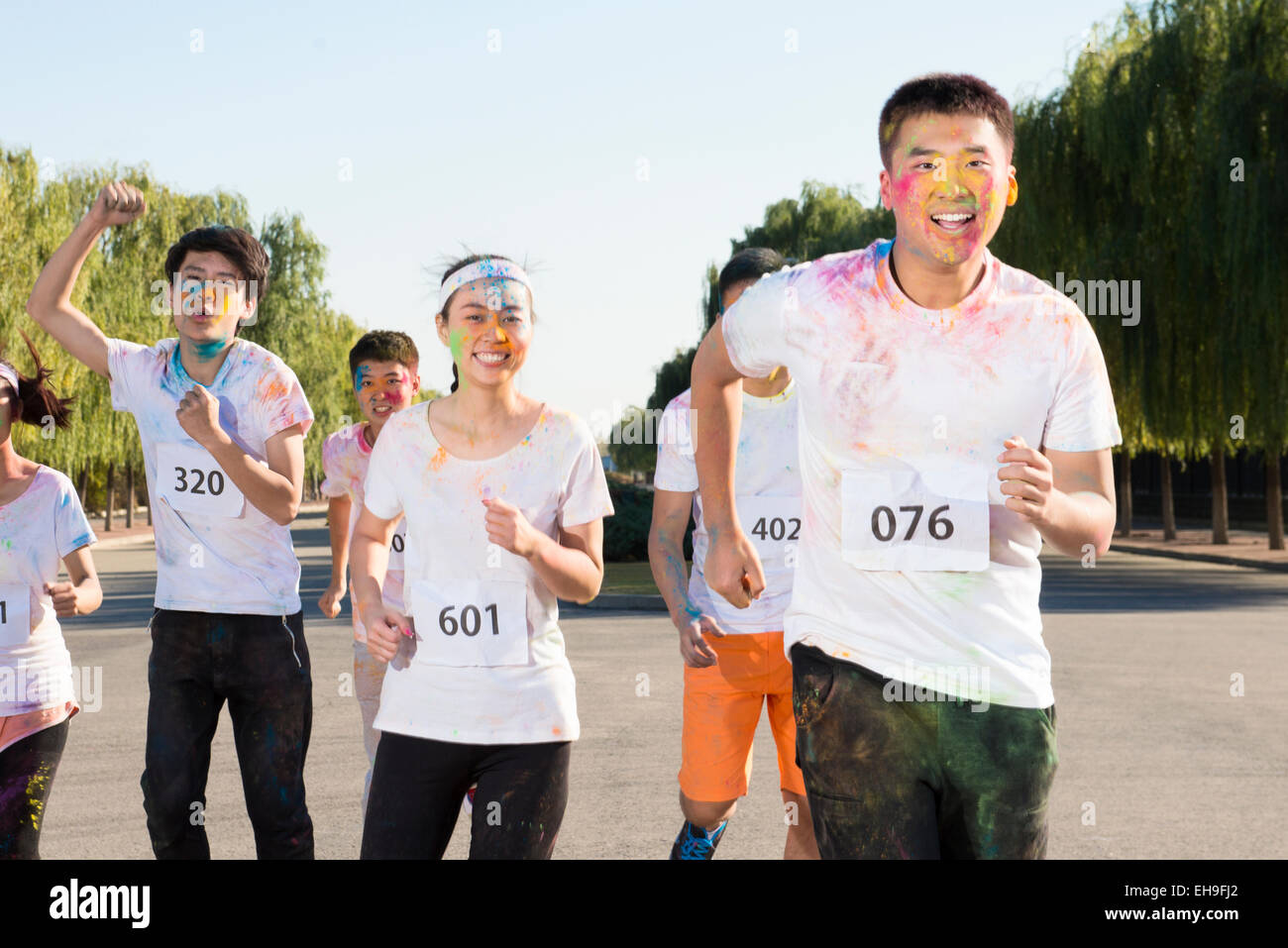 Young man leading at The Color Run Stock Photo - Alamy