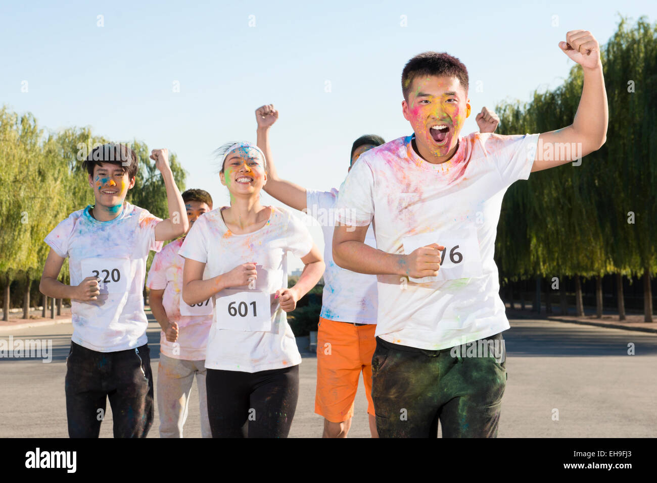 Young man leading at The Color Run Stock Photo - Alamy