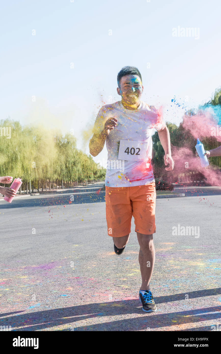 Young man at The Color Run Stock Photo - Alamy