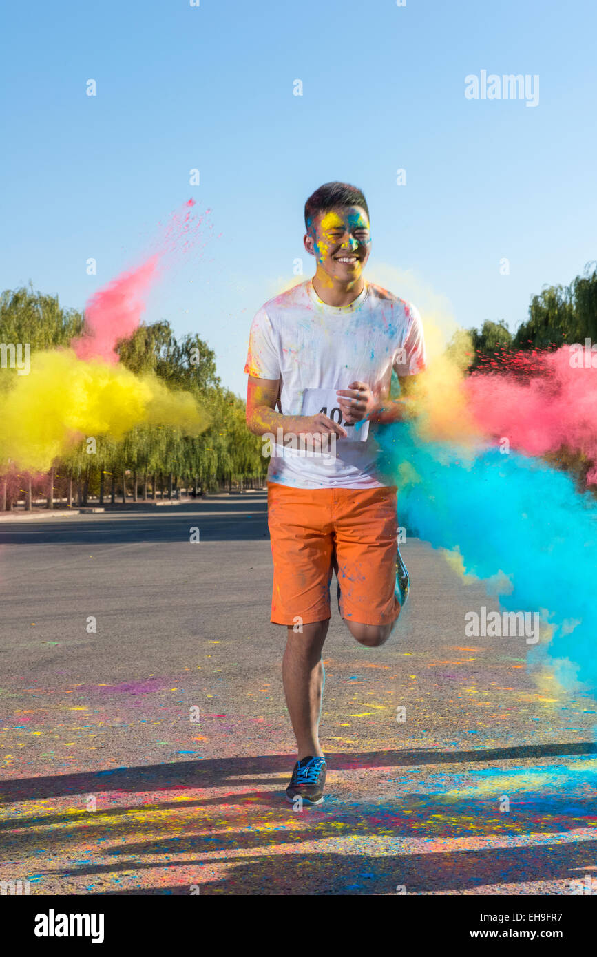 Young man at The Color Run Stock Photo - Alamy