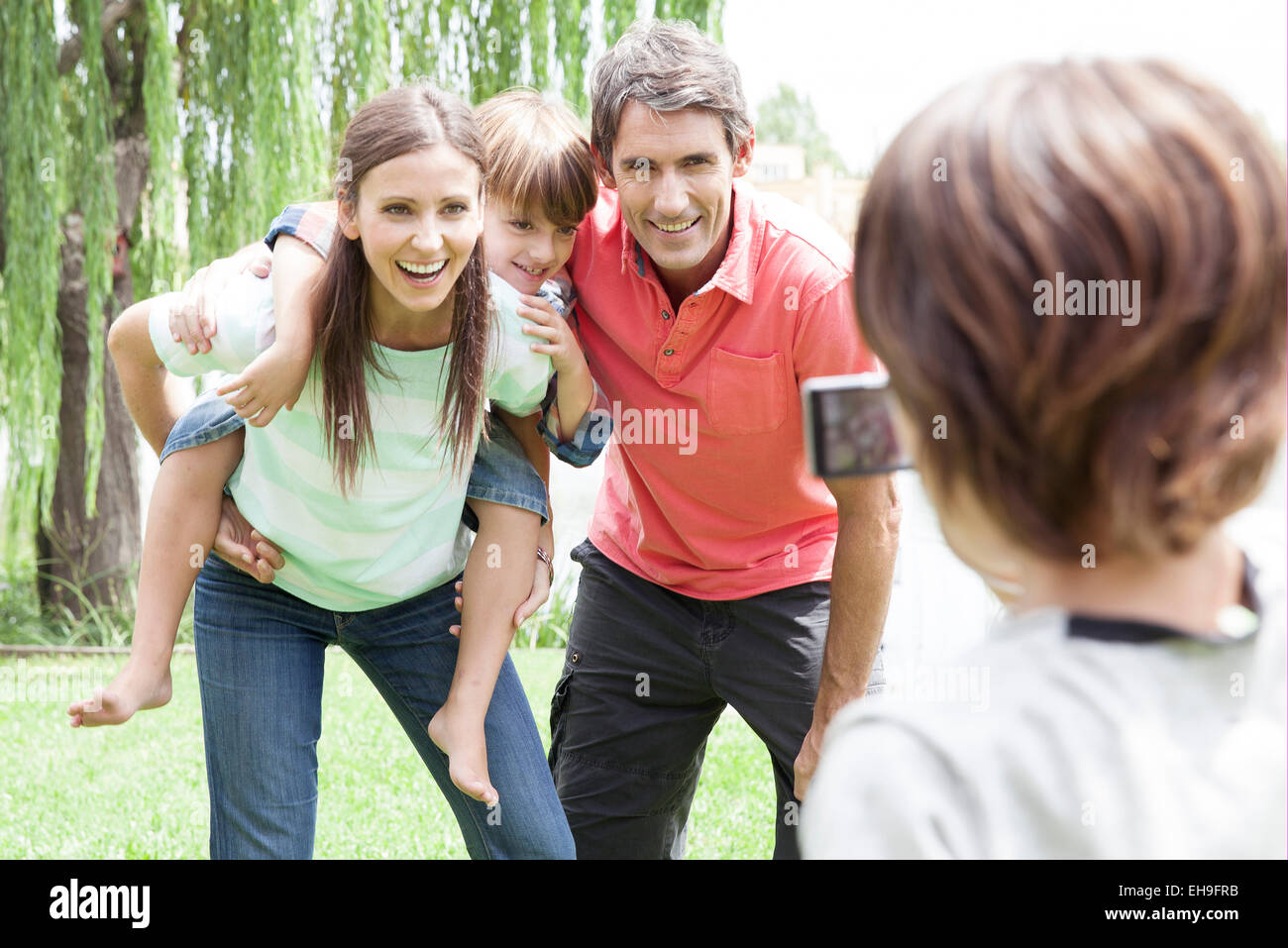 Boy taking snapshot of his family Stock Photo - Alamy