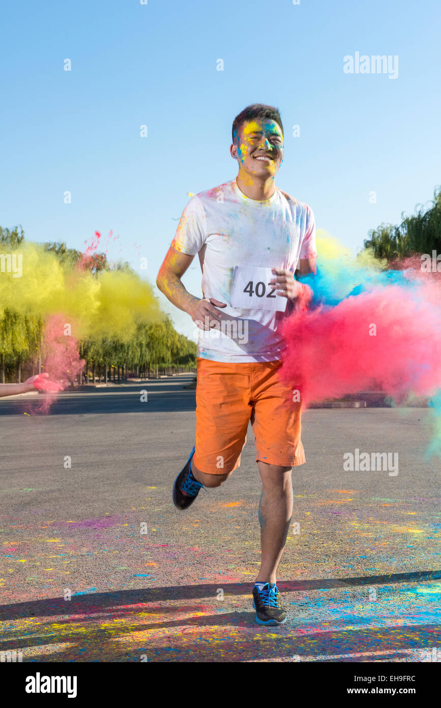 Young man at The Color Run Stock Photo - Alamy
