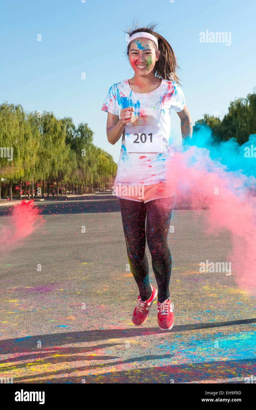 Young woman at The Color Run Stock Photo - Alamy