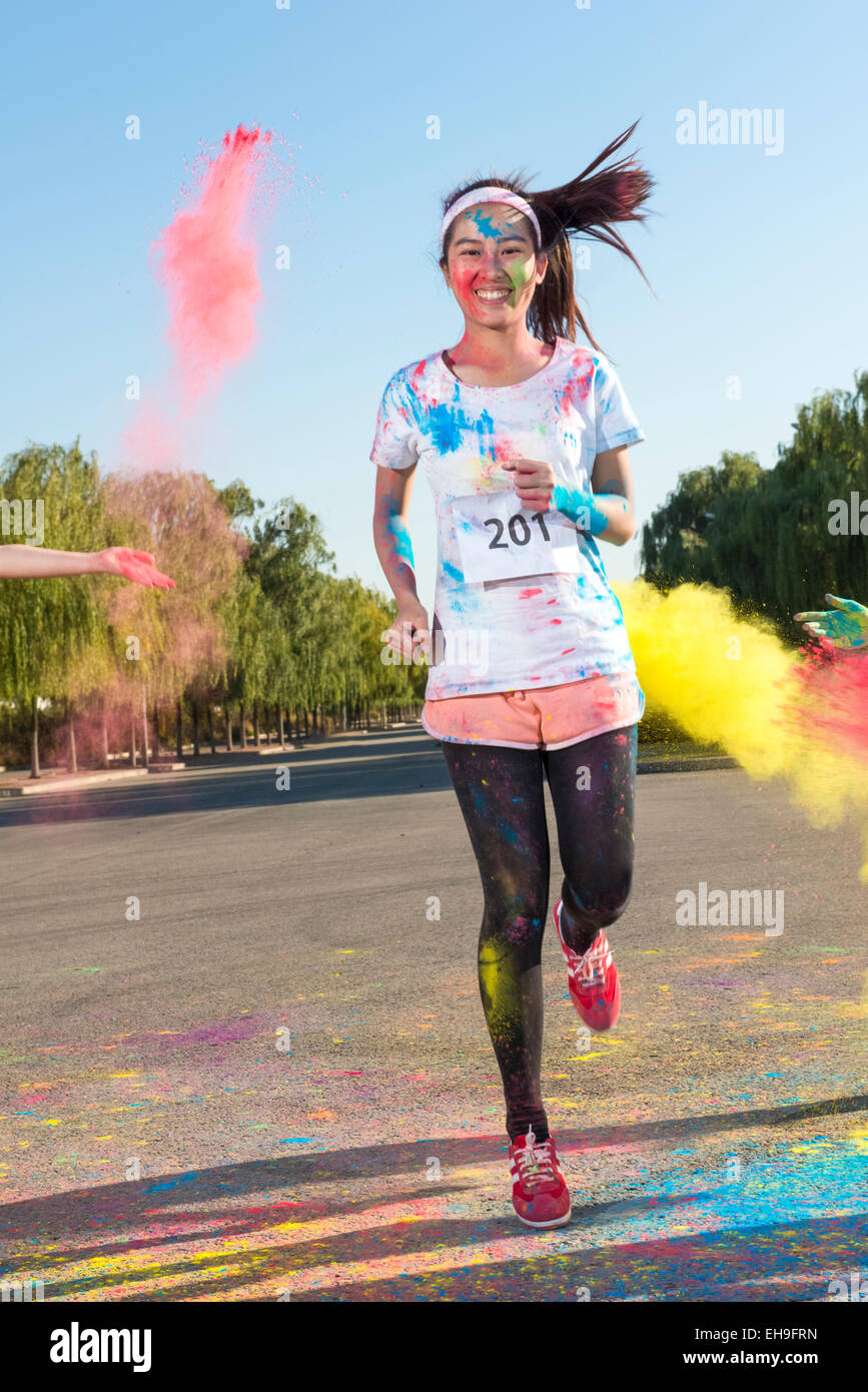 Young woman at The Color Run Stock Photo - Alamy