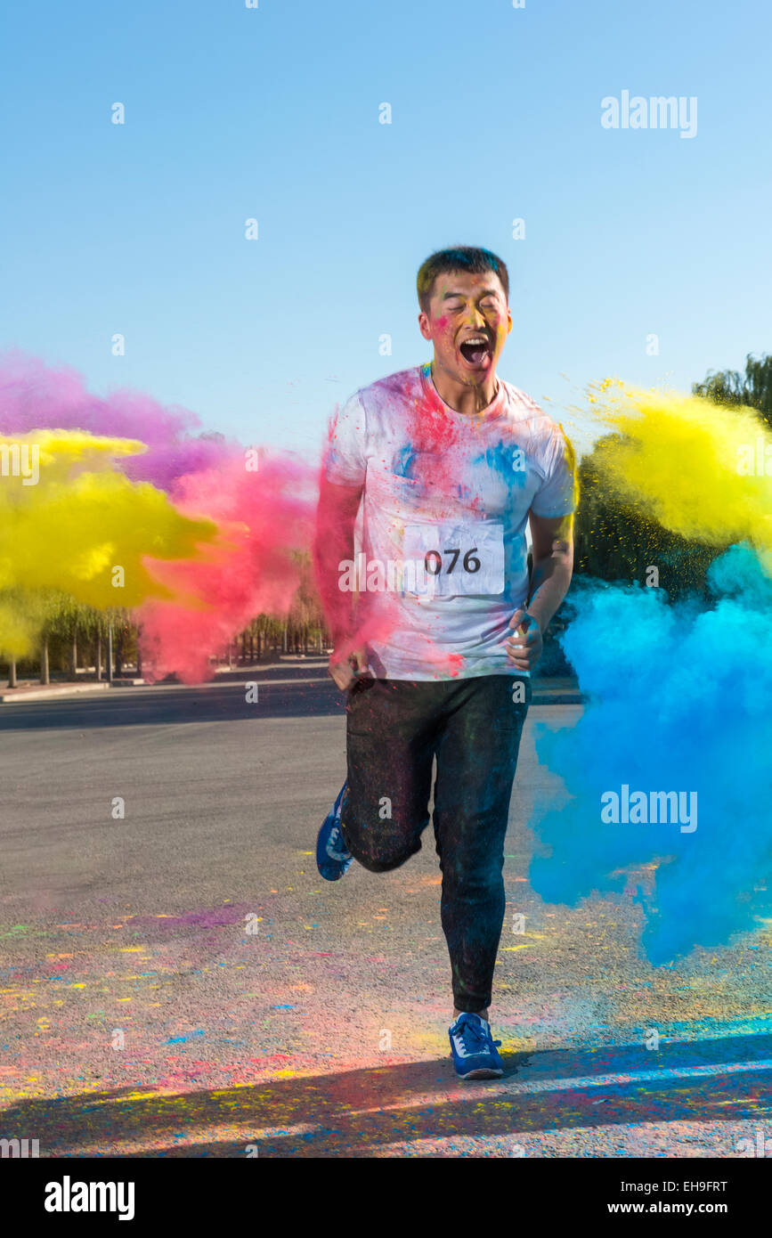 Young man at The Color Run Stock Photo - Alamy