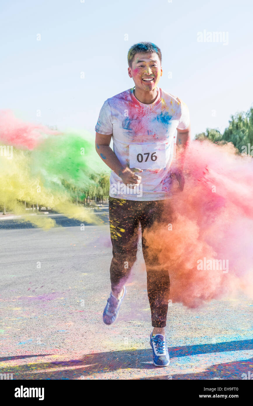Young man at The Color Run Stock Photo - Alamy
