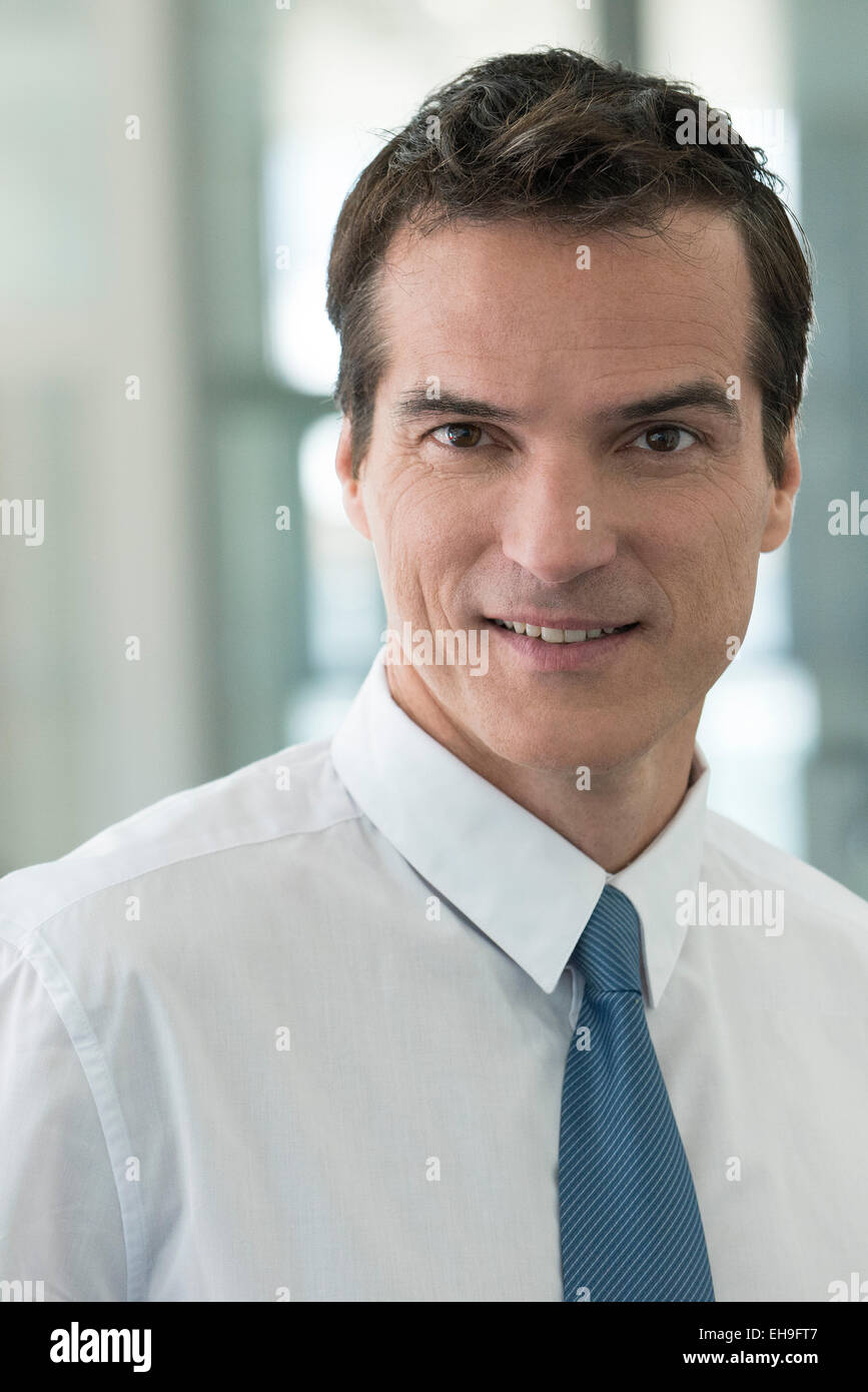 Businessman smiling, portrait Stock Photo - Alamy