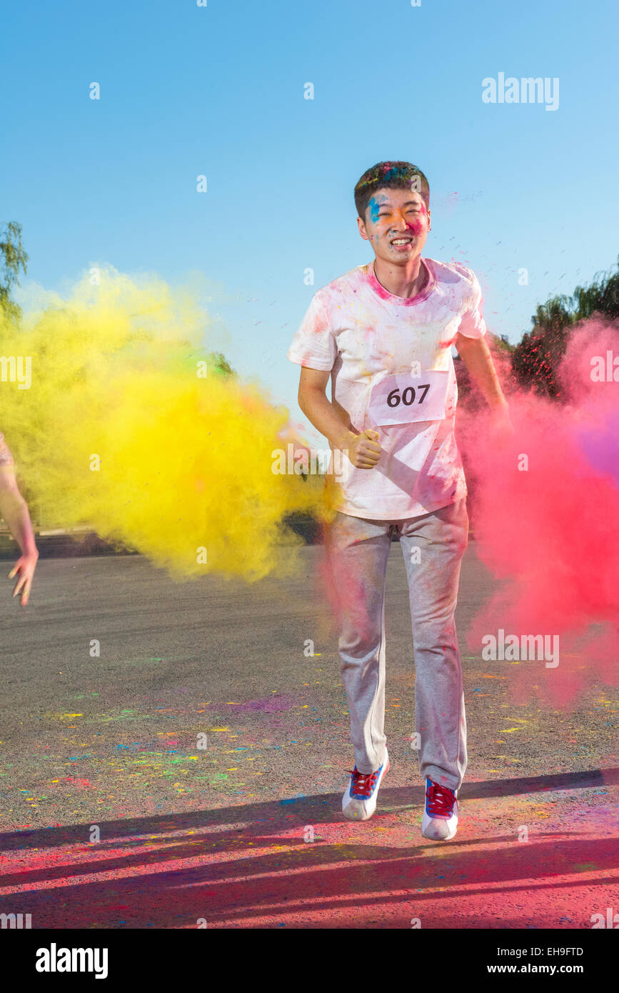 Young man at The Color Run Stock Photo - Alamy