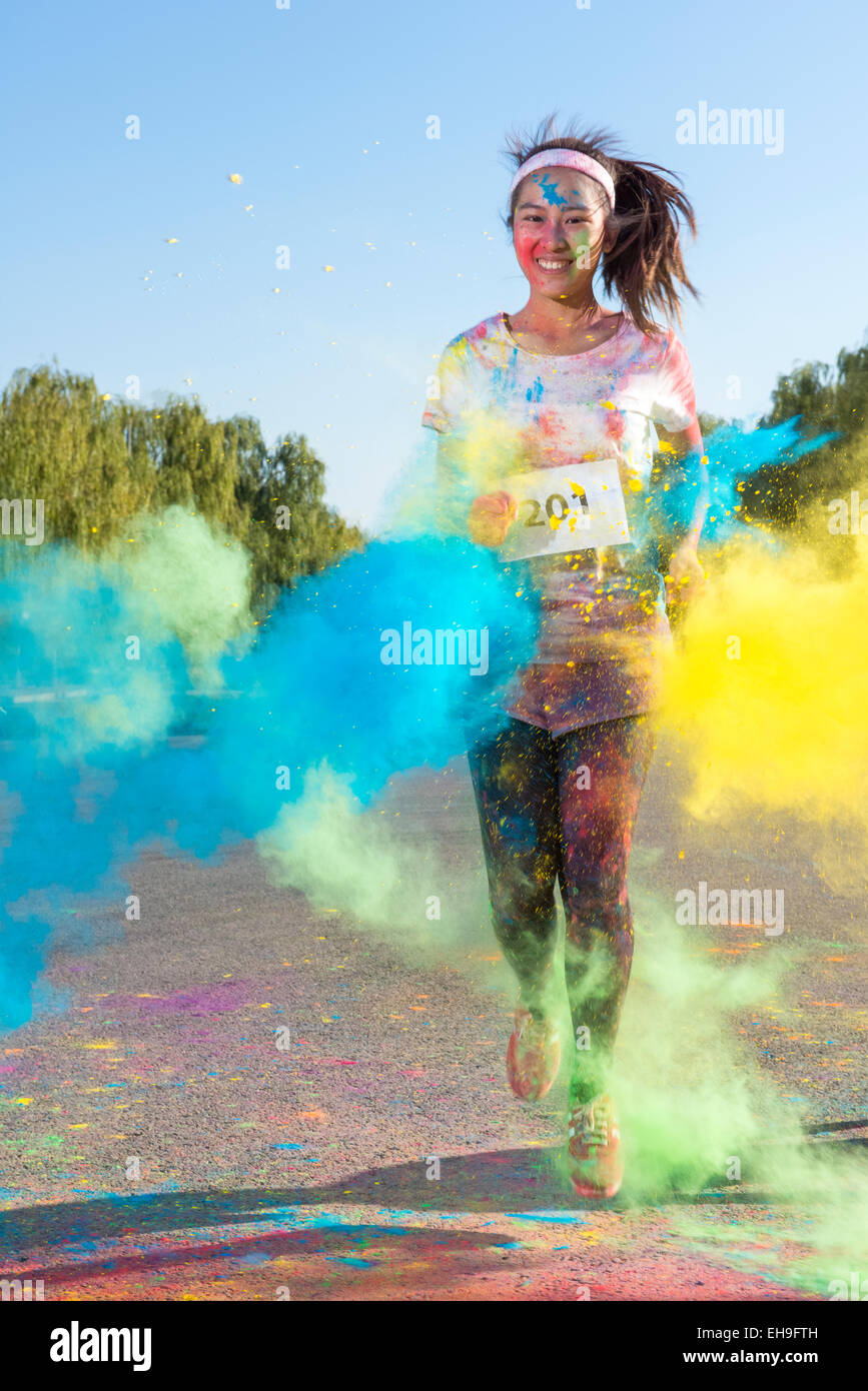 Young woman at The Color Run Stock Photo - Alamy