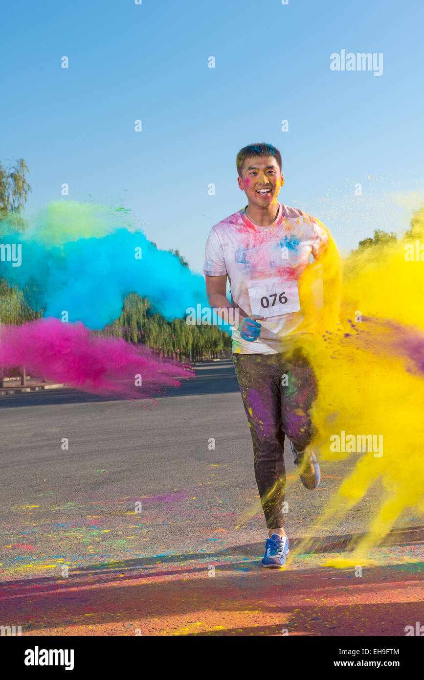Young man at The Color Run Stock Photo - Alamy