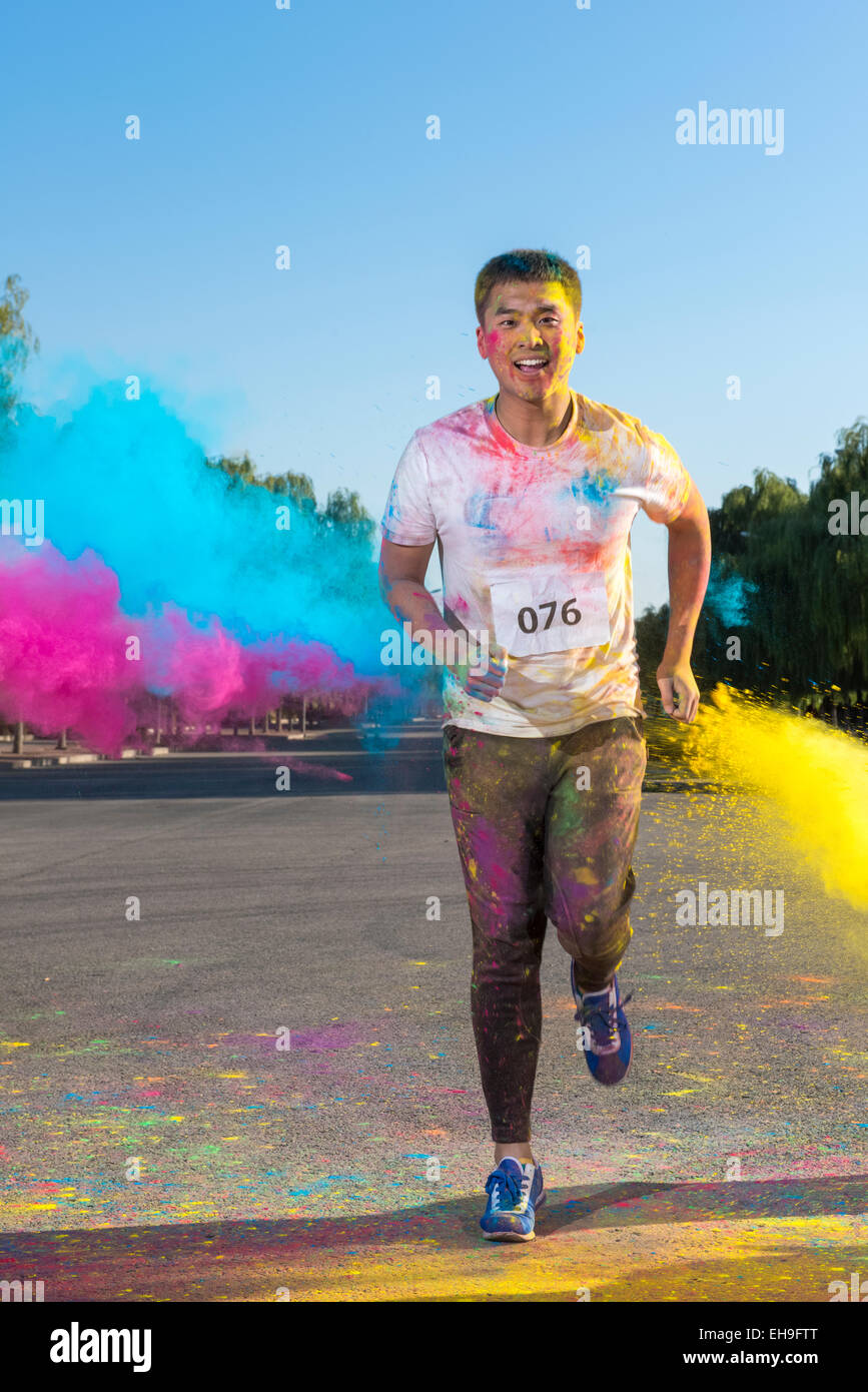 Young man at The Color Run Stock Photo - Alamy
