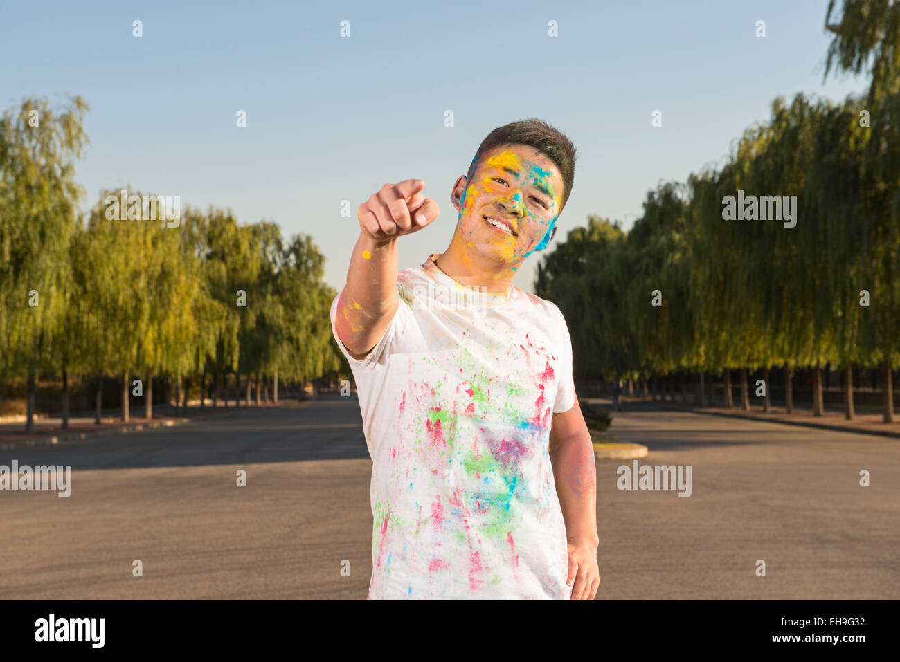 Young man at The Color Run Stock Photo - Alamy