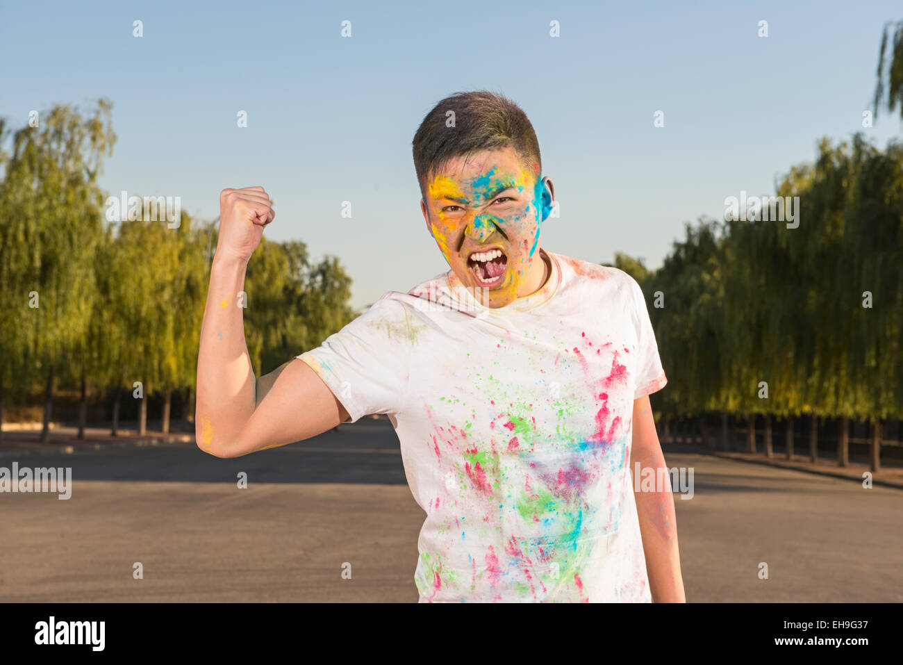 Young man at The Color Run Stock Photo - Alamy