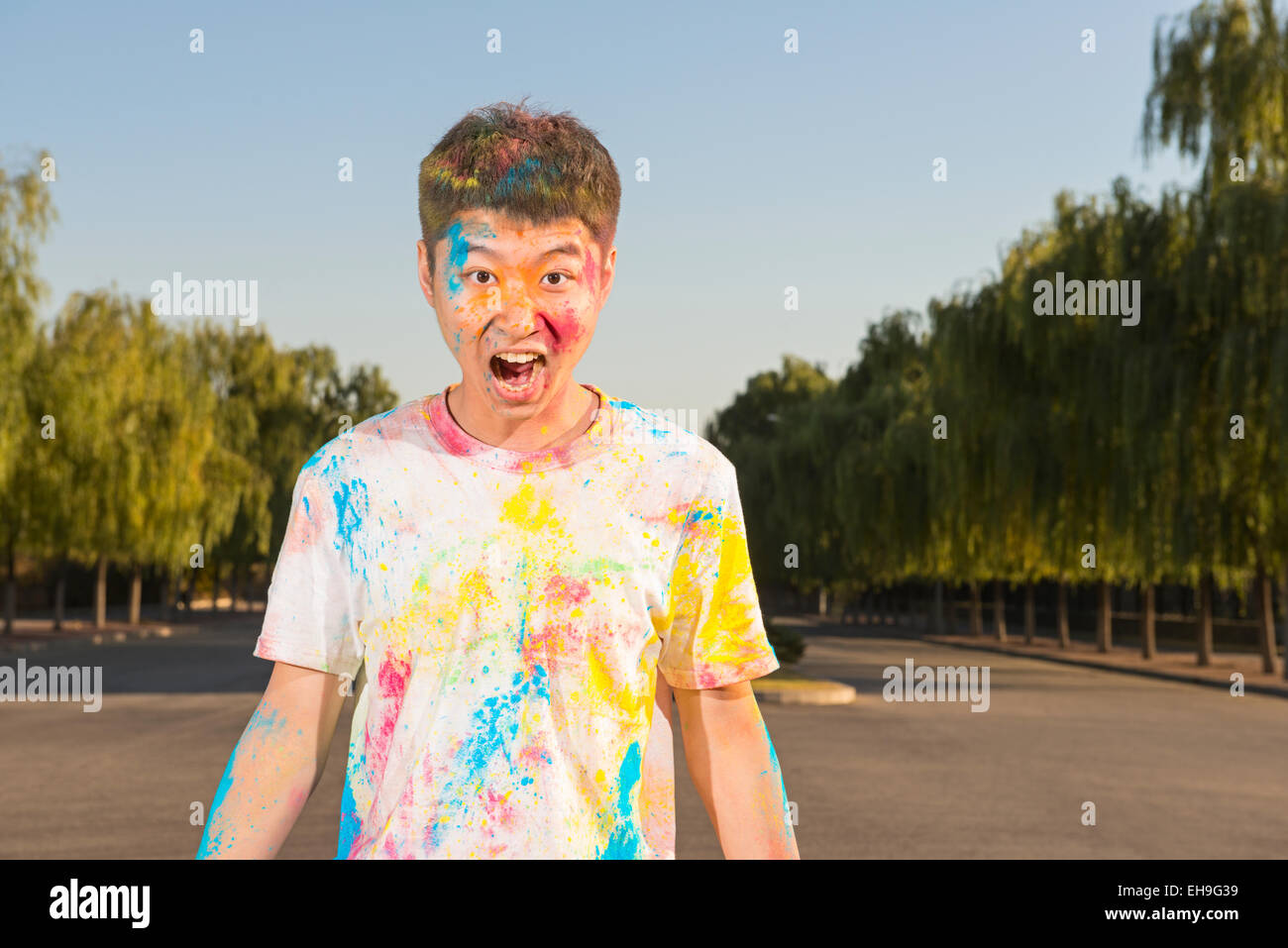 Young man at The Color Run Stock Photo - Alamy