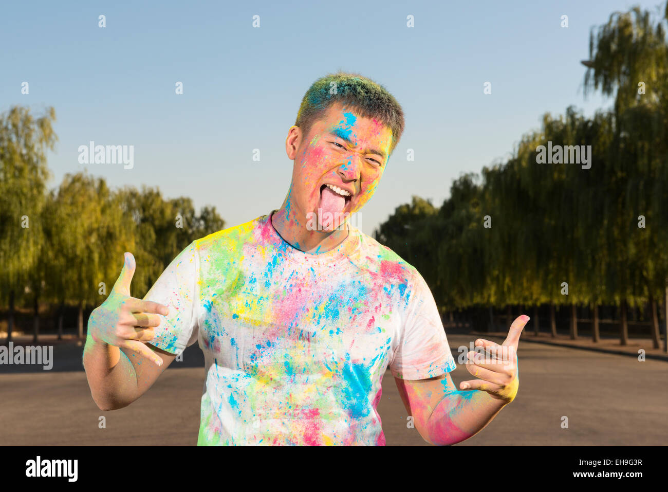 Young man at The Color Run Stock Photo - Alamy