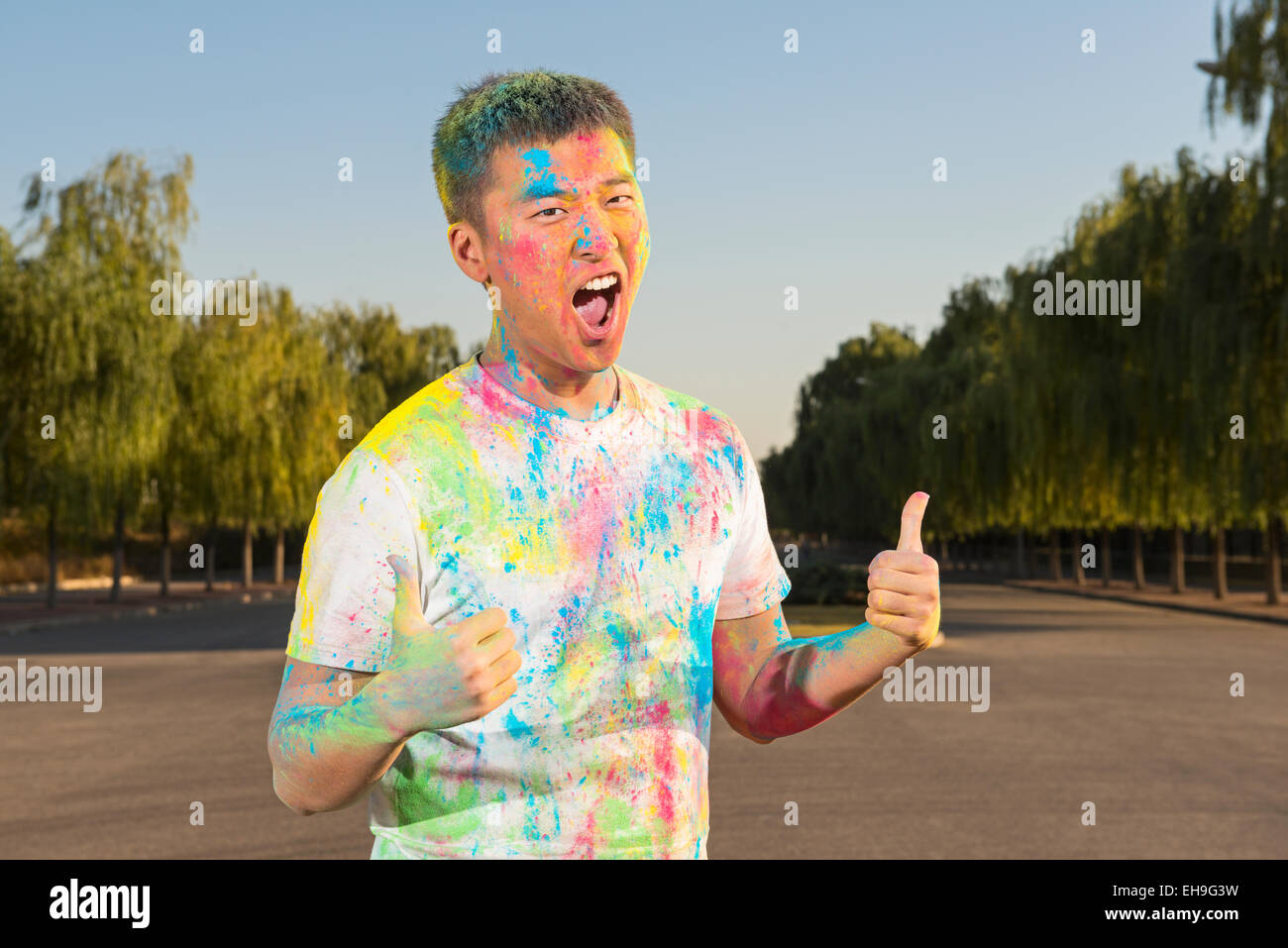 Young man at The Color Run Stock Photo - Alamy
