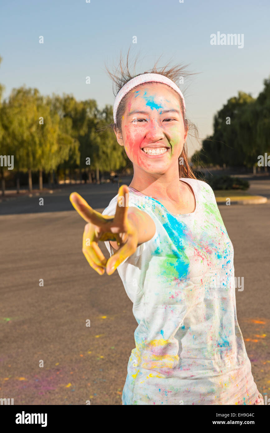 Young woman at The Color Run Stock Photo - Alamy