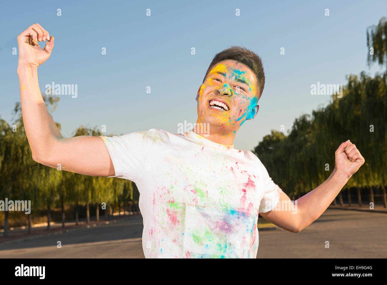 Young man at The Color Run Stock Photo - Alamy
