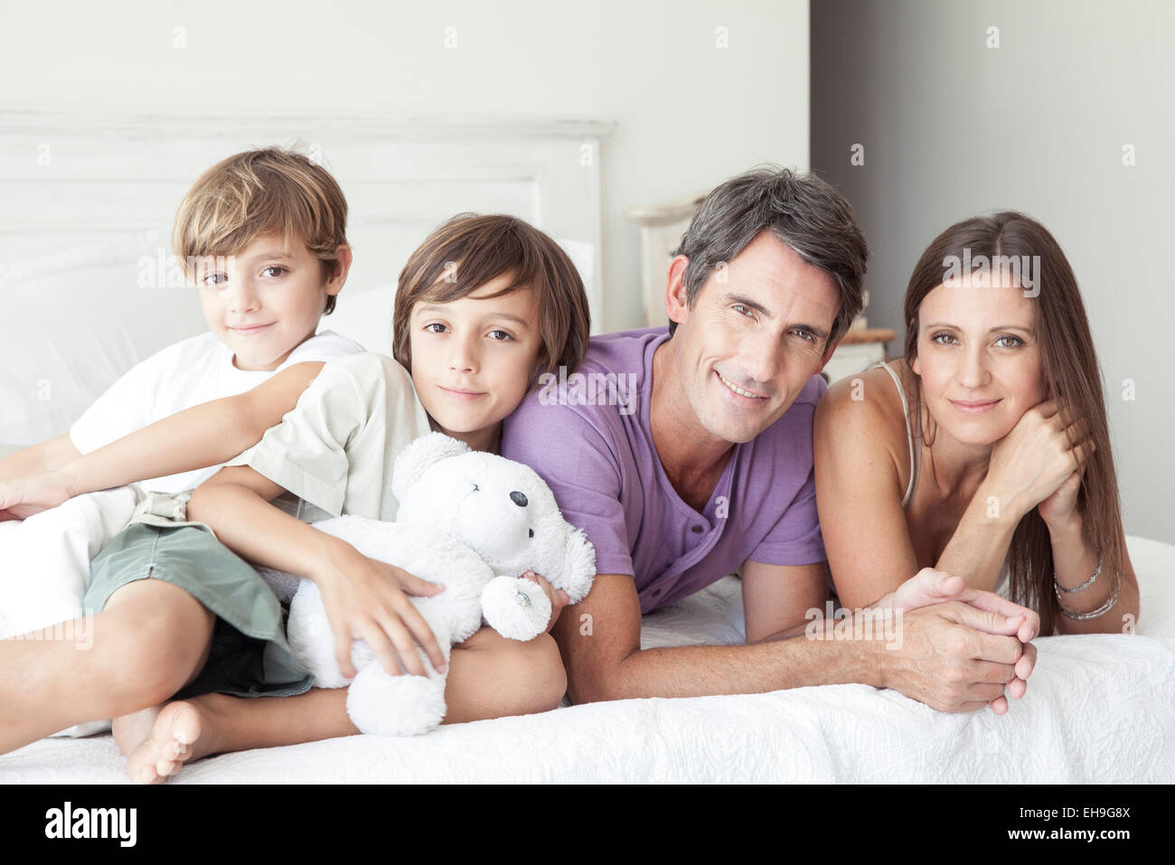 Parents with young boys, portrait Stock Photo - Alamy