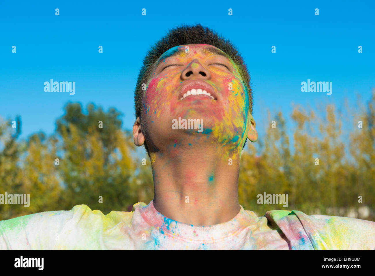 Young man at The Color Run Stock Photo - Alamy