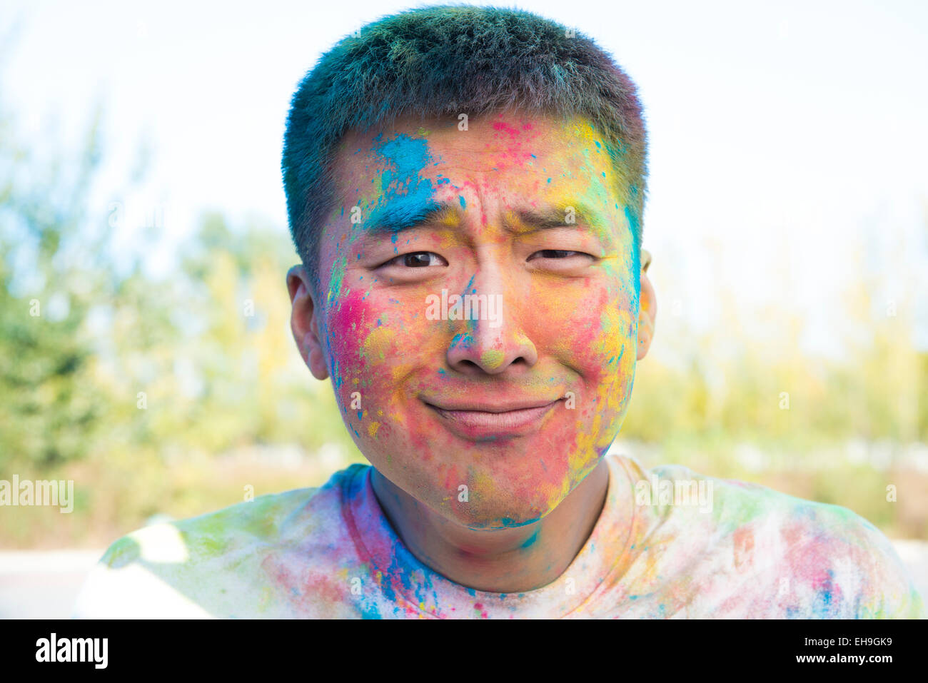Young man at The Color Run Stock Photo - Alamy