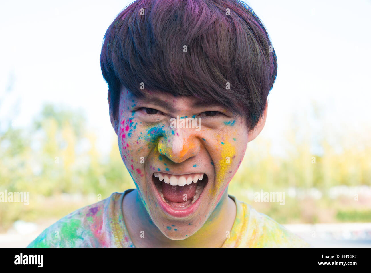 Young man at The Color Run Stock Photo - Alamy