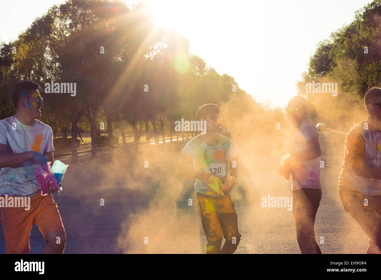 People throwing powder at The Color Run Stock Photo - Alamy