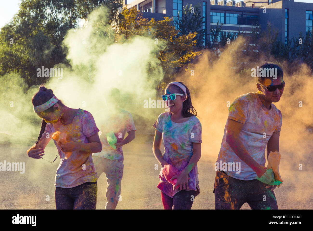 People throwing powder at The Color Run Stock Photo - Alamy