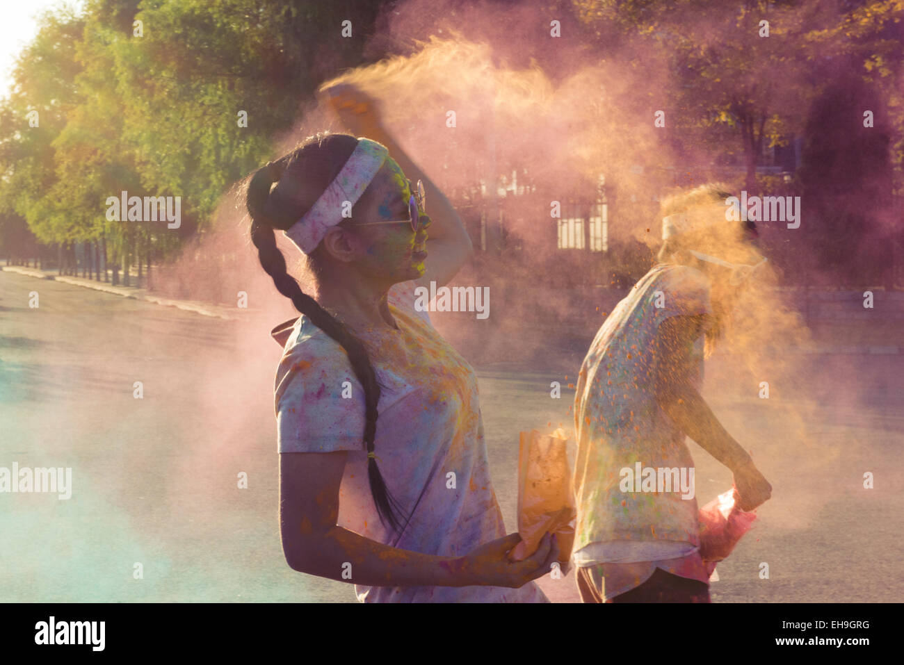 People throwing powder at The Color Run Stock Photo - Alamy
