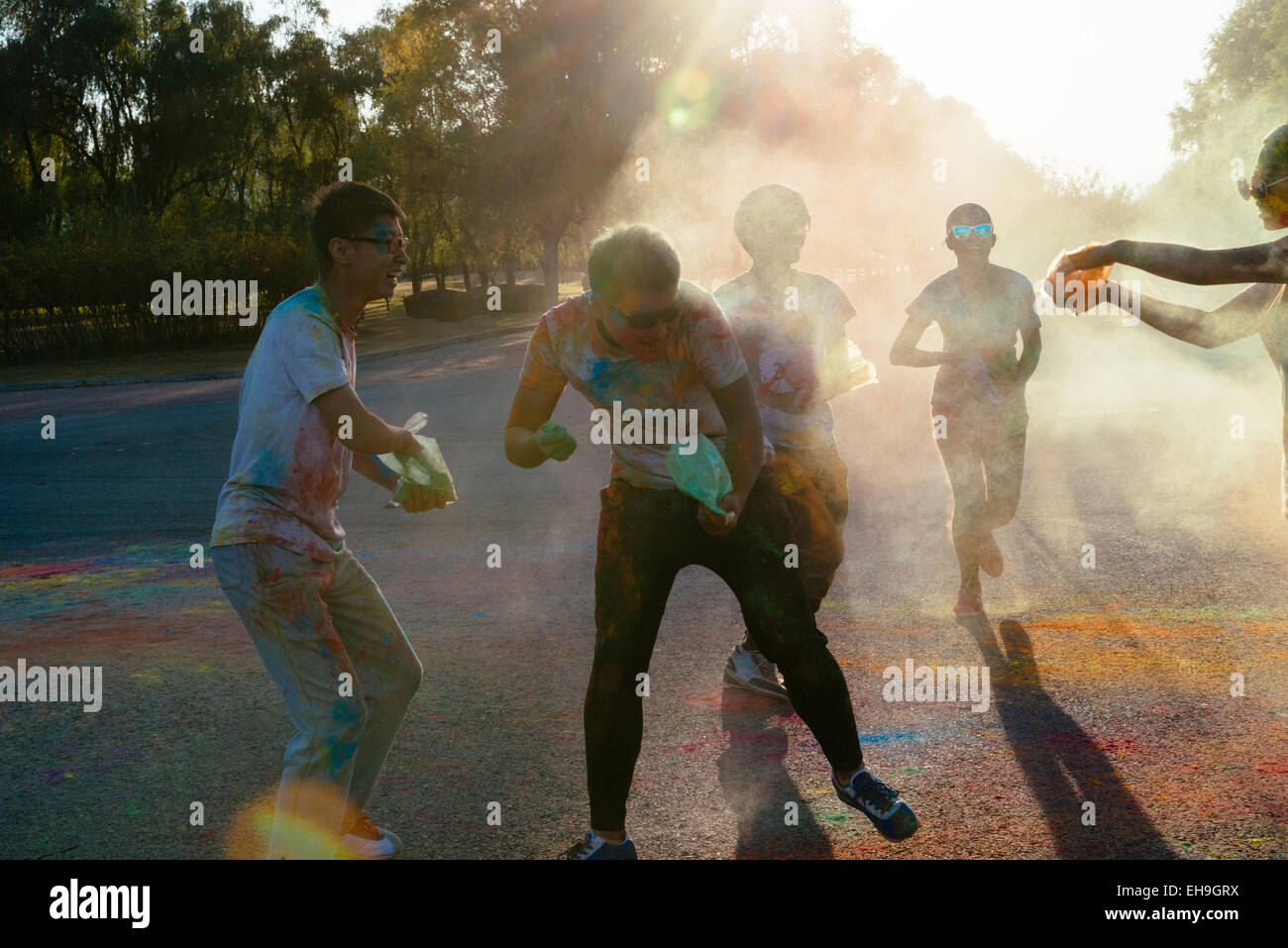 People throwing powder at The Color Run Stock Photo - Alamy