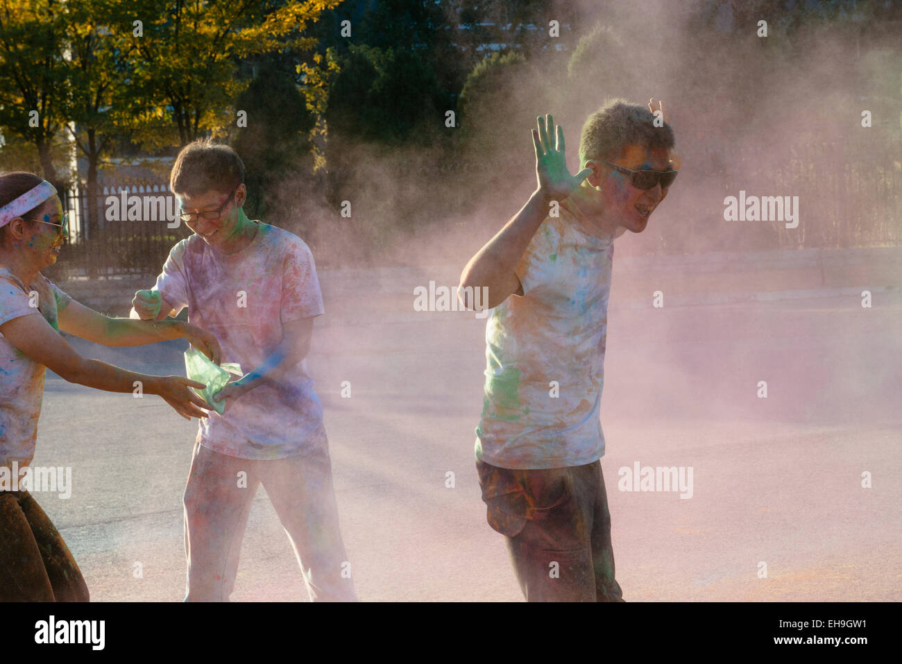People throwing powder at The Color Run Stock Photo - Alamy