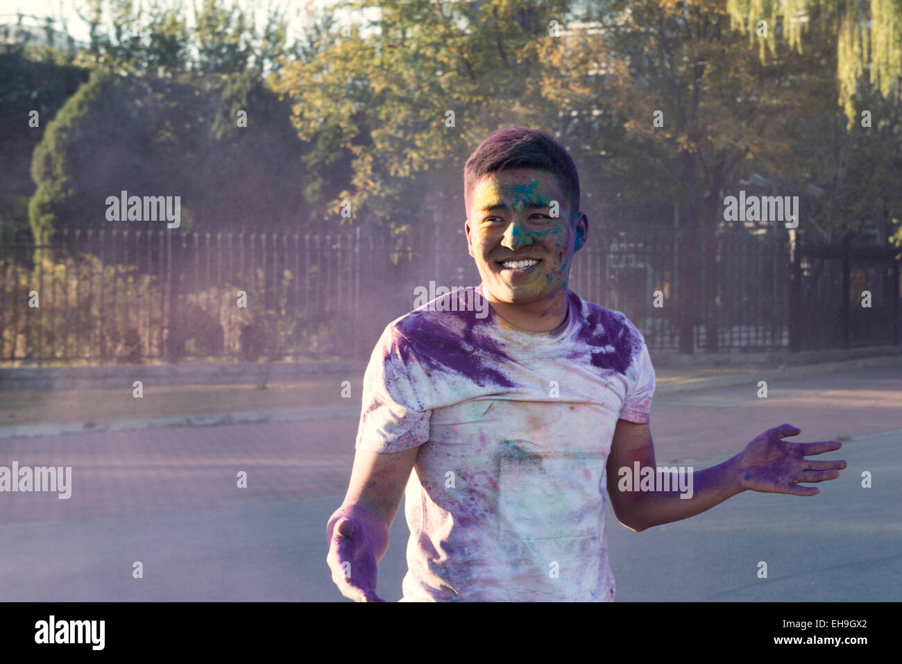 Young man at The Color Run Stock Photo - Alamy
