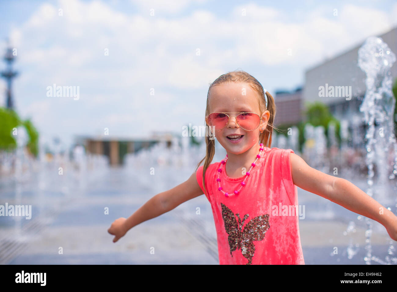 Adorable girl have fun at hot sunny day Stock Photo - Alamy