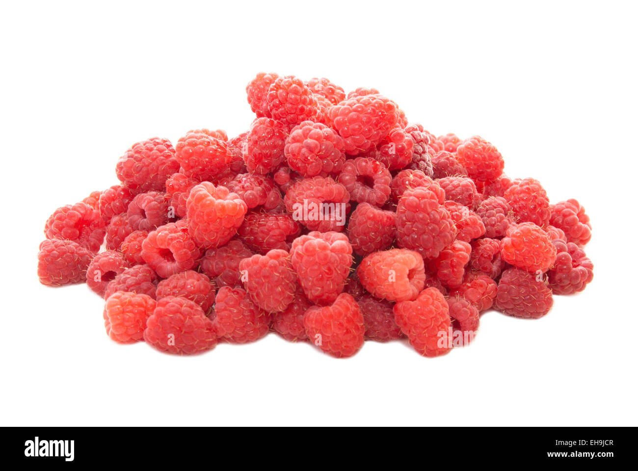 Pile of raspberries isolated on white background Stock Photo - Alamy