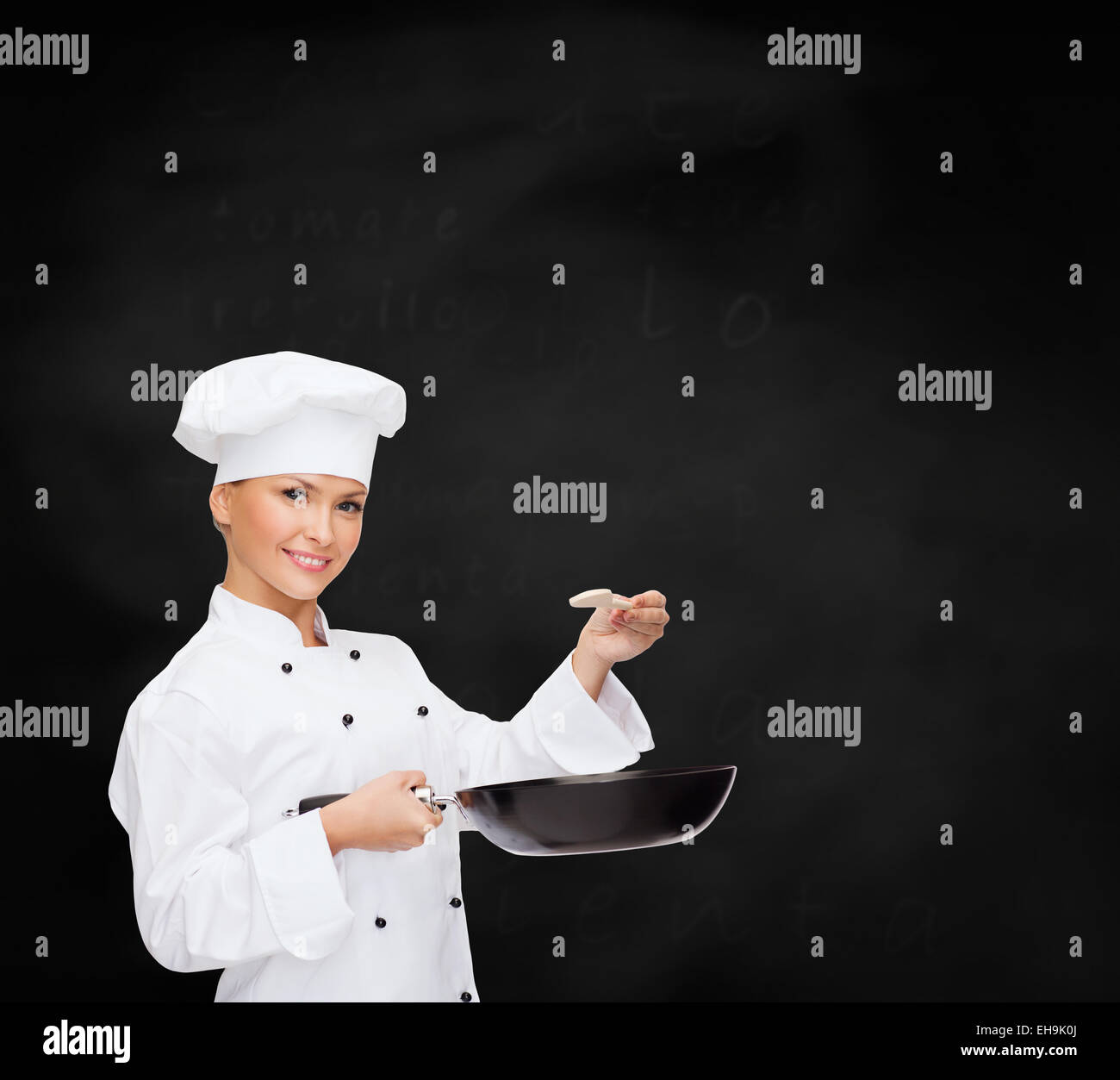 smiling female chef with pan and spoon Stock Photo - Alamy