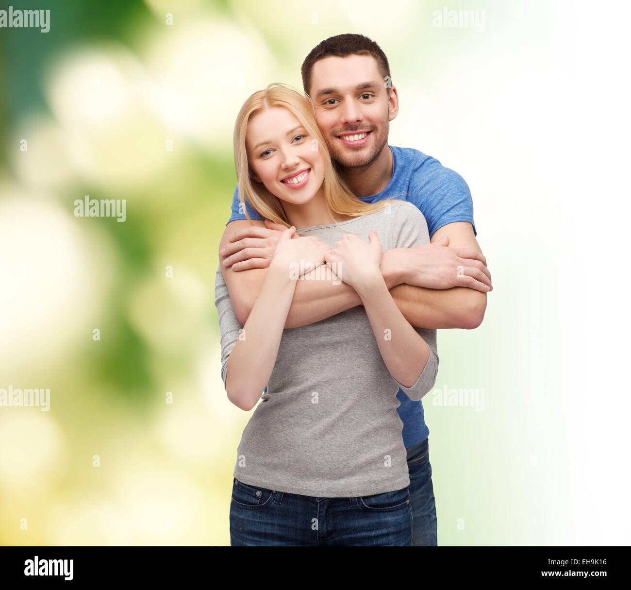 smiling couple hugging Stock Photo - Alamy