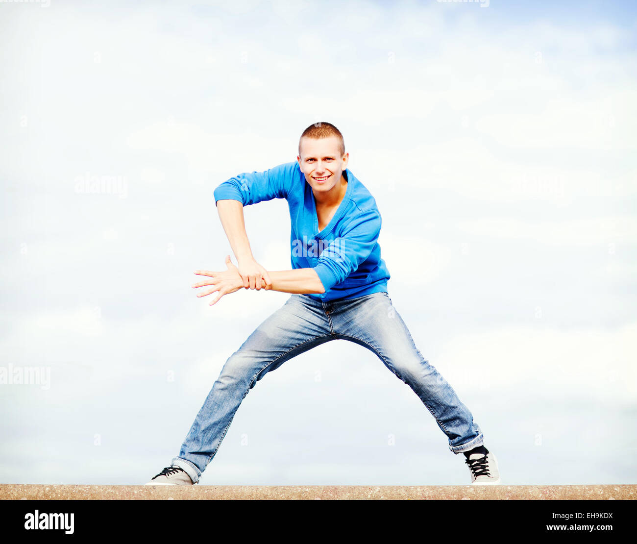 handsome boy making dance move Stock Photo - Alamy