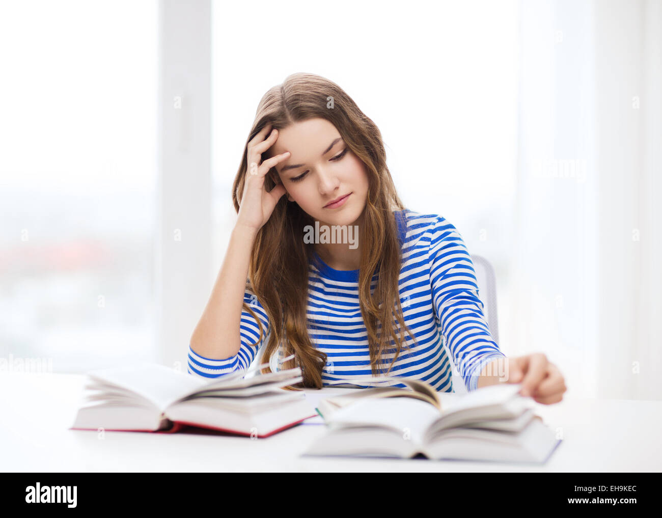 stressed student girl with books Stock Photo - Alamy