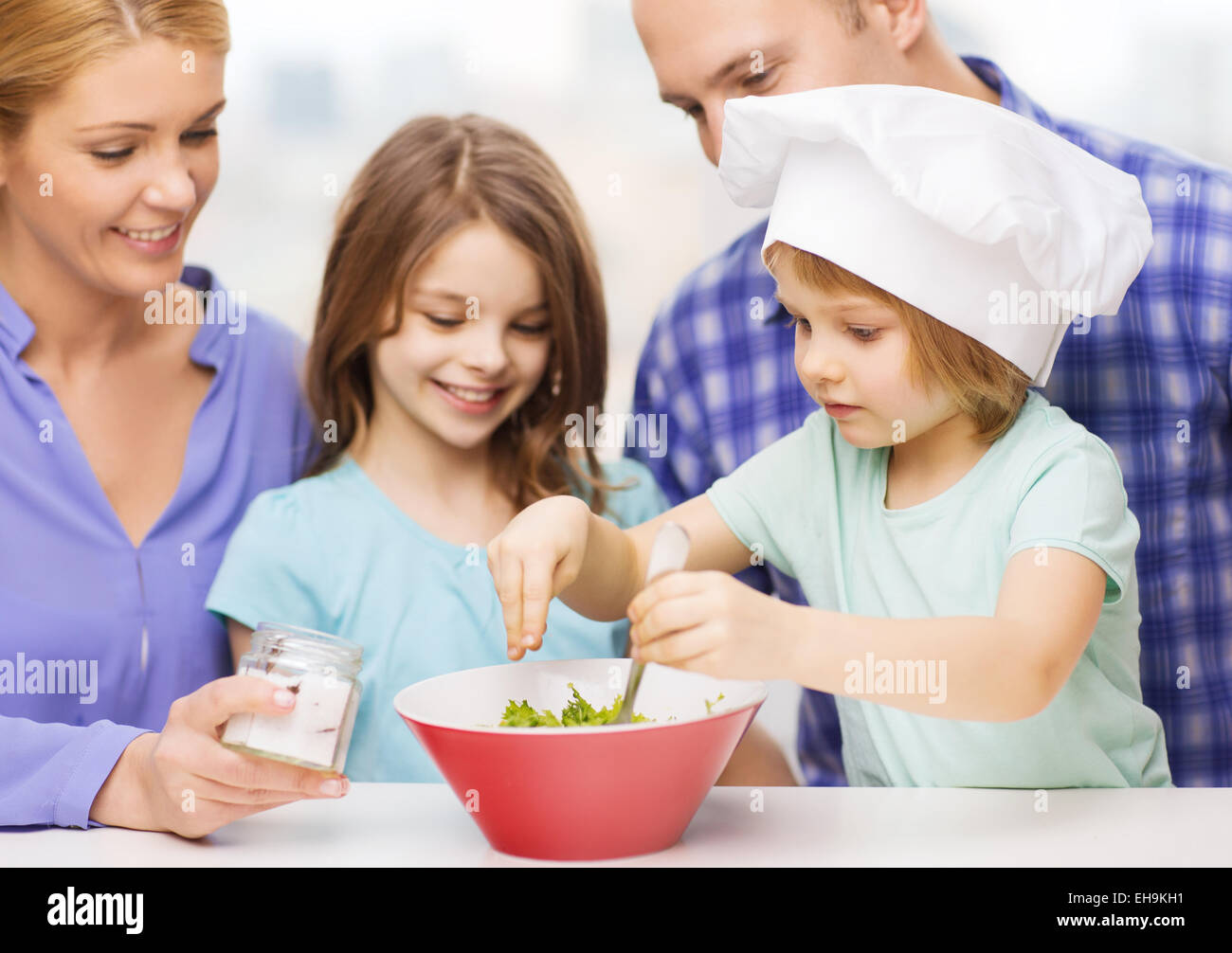 happy family with two kids eating at home Stock Photo - Alamy